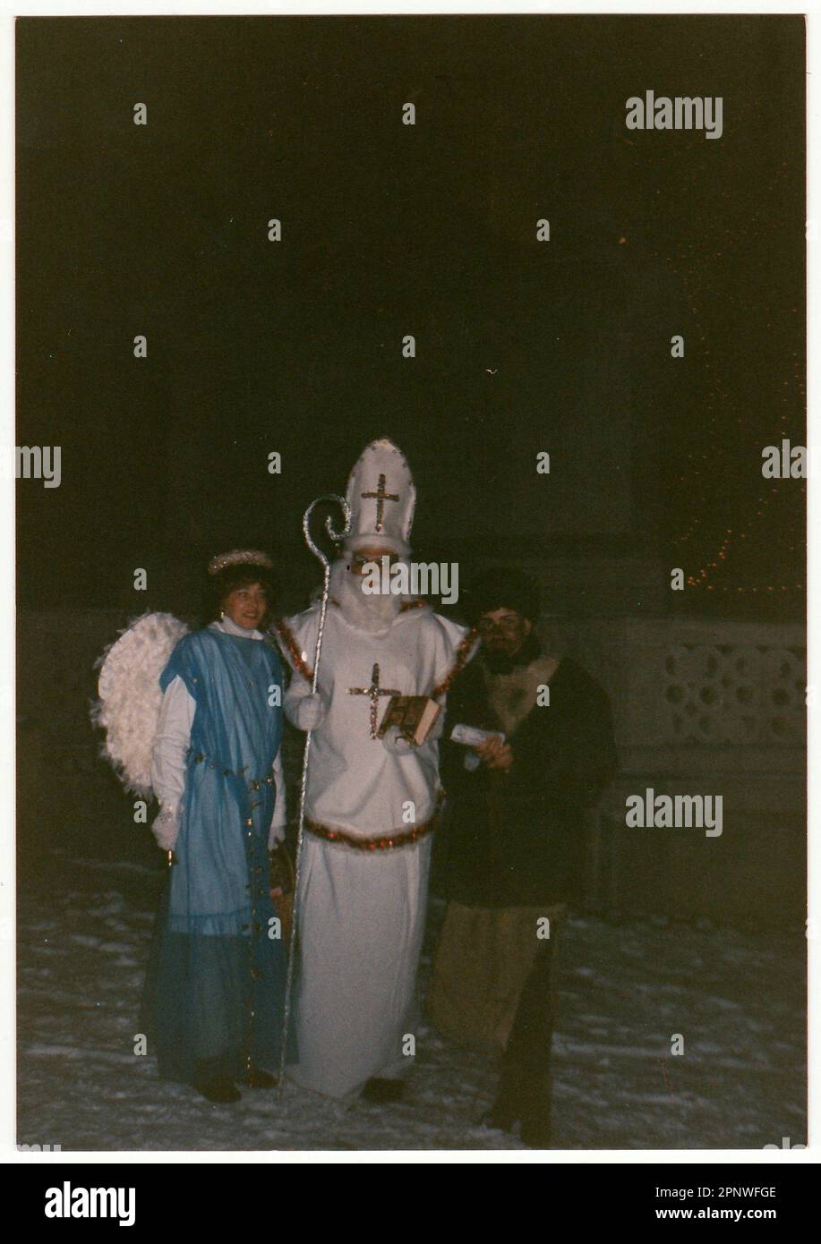 Vintage photo shows people in costums the St. Nicholas, the Angel, and ...