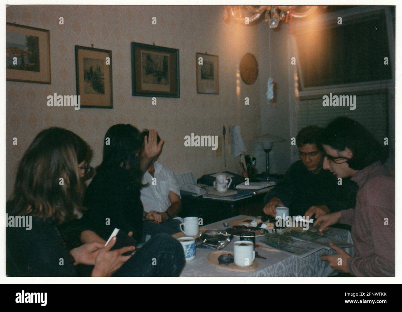 Retro photo shows people at the home party Stock Photo - Alamy