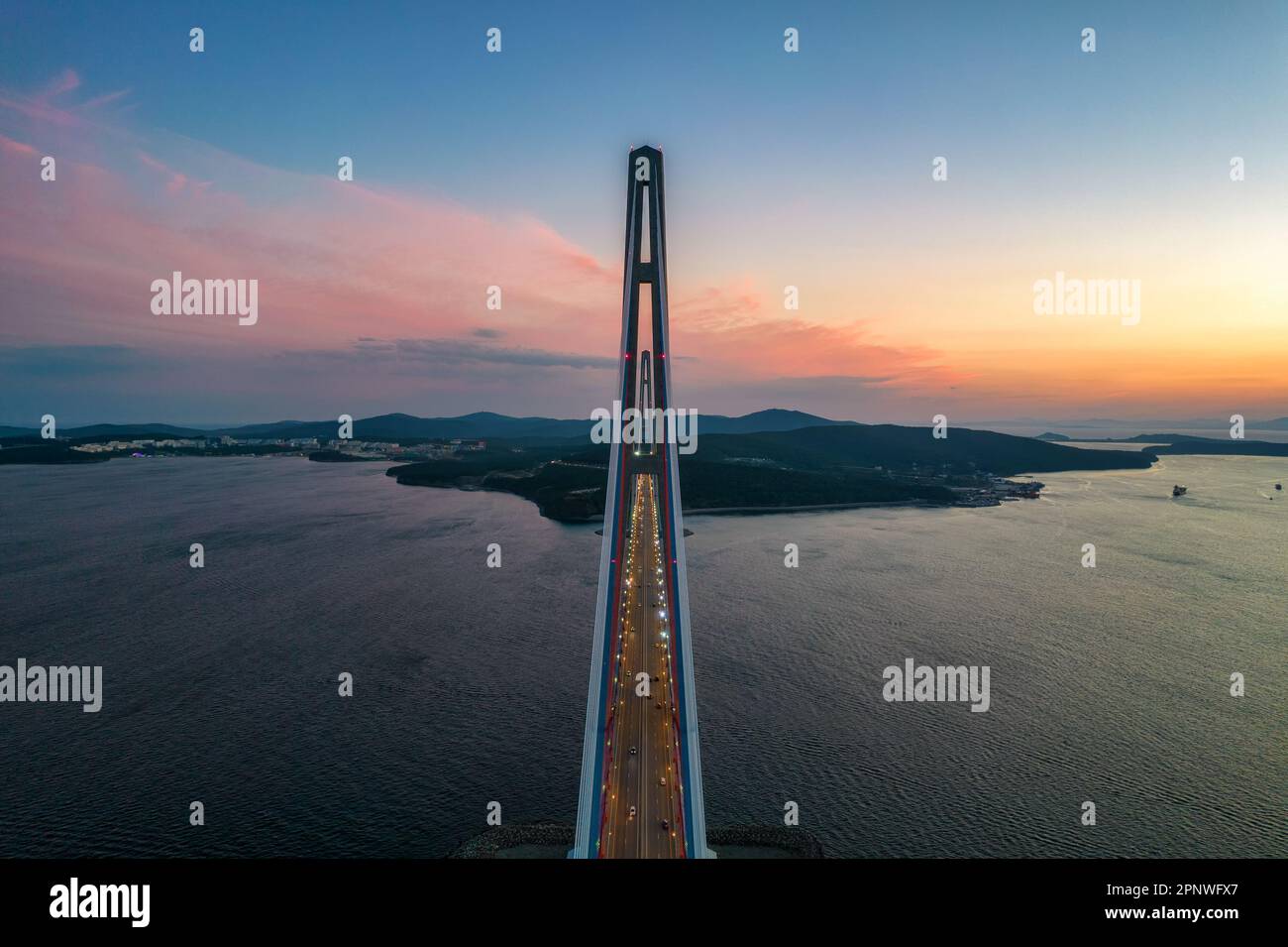 Sunset aerial view of famous cable-stayed bridge to Russky island from ...