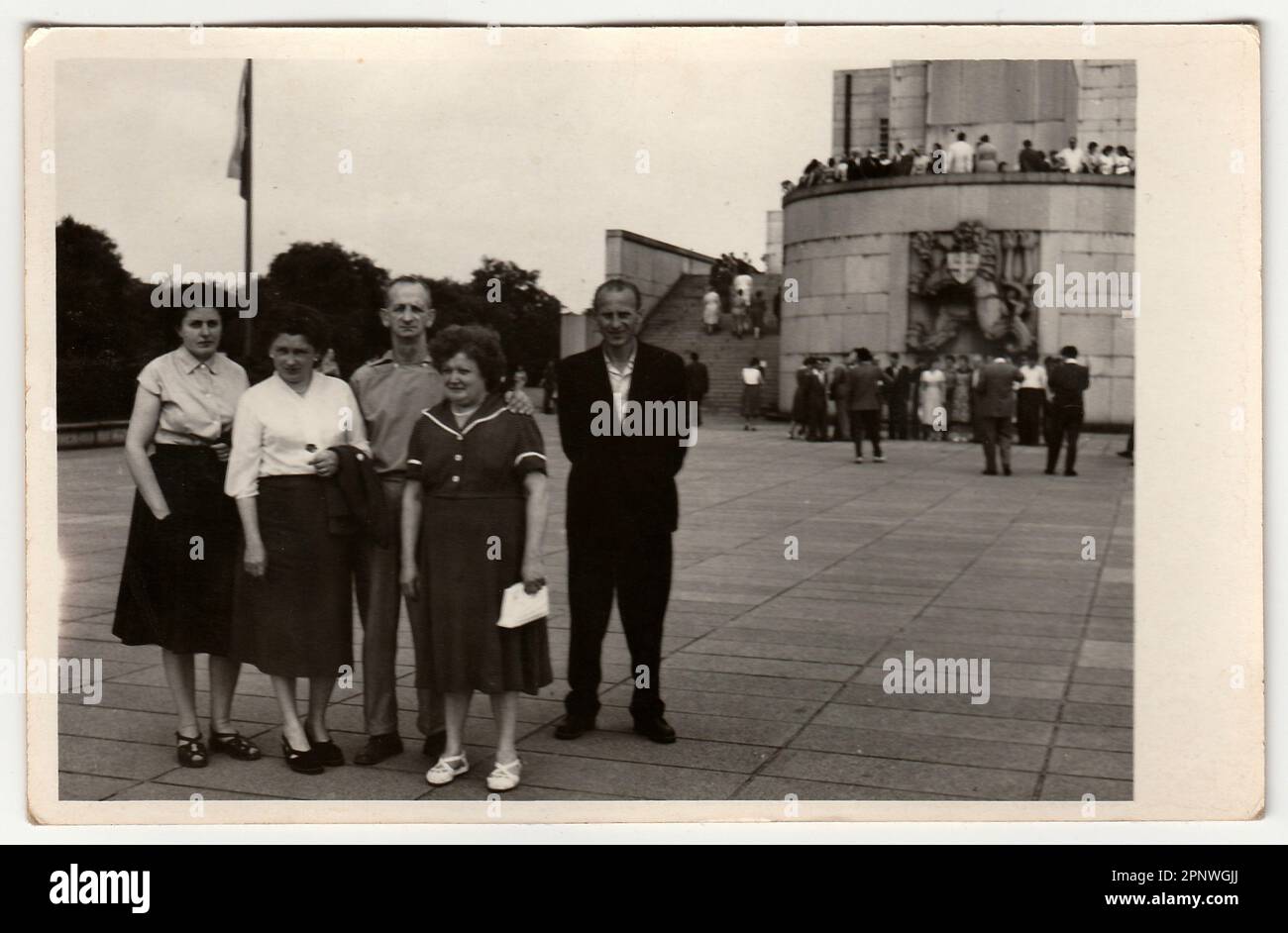 Vintage photo shows group of people stands in front of communist ...