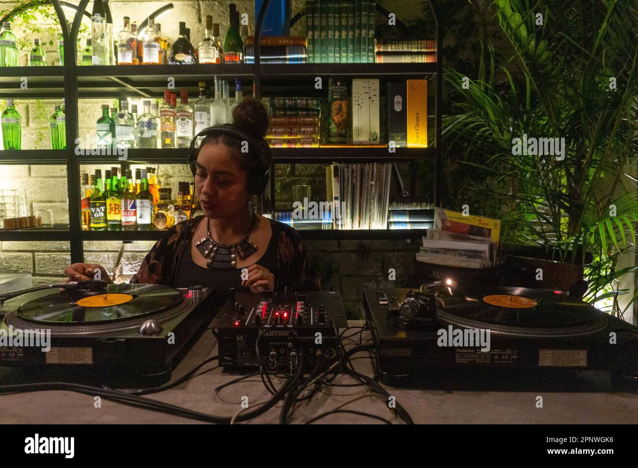 Cami Layé Okún, who is from Cuba, plays records in San Cristóbal de Las ...