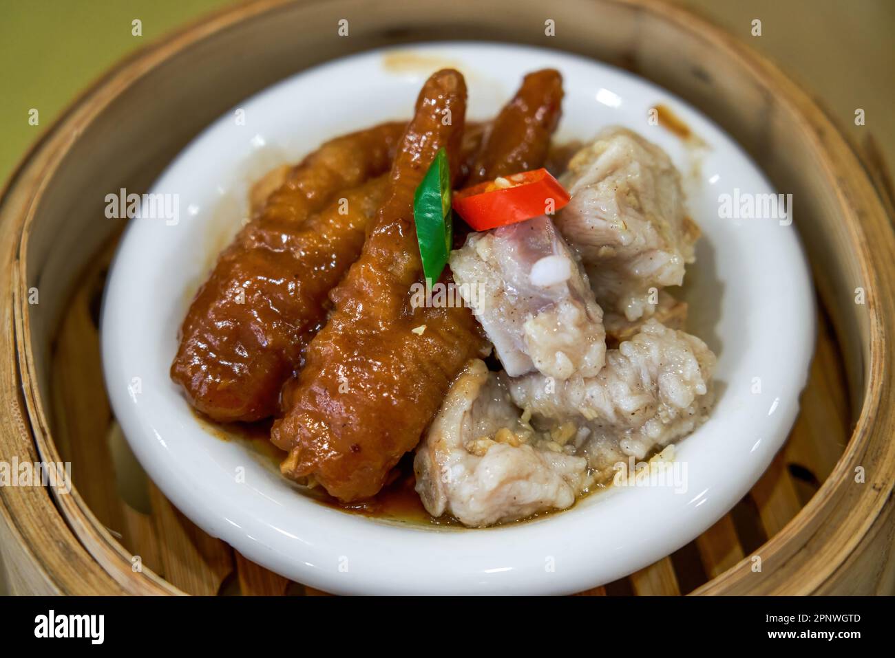 A delicious Cantonese morning tea dim sum, steamed chicken feet and ...