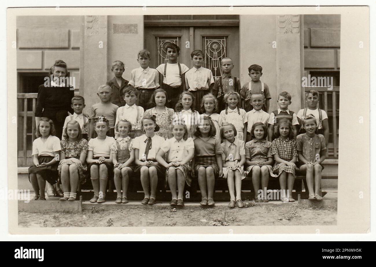 Vintage photo shows pupils - schoolmates and their female teacher Stock ...