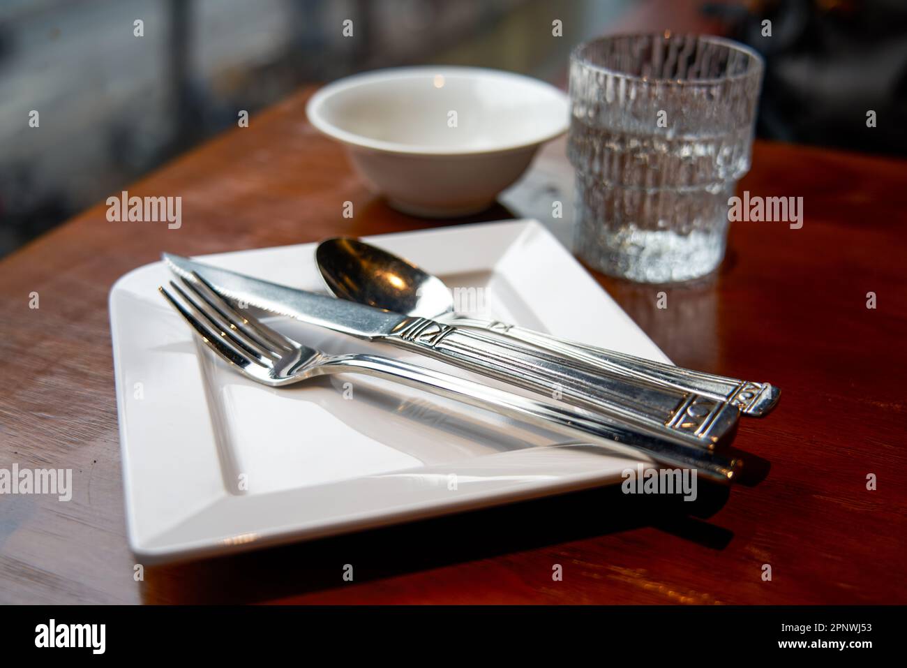 Various tableware on the table in the western restaurant Stock Photo - Alamy