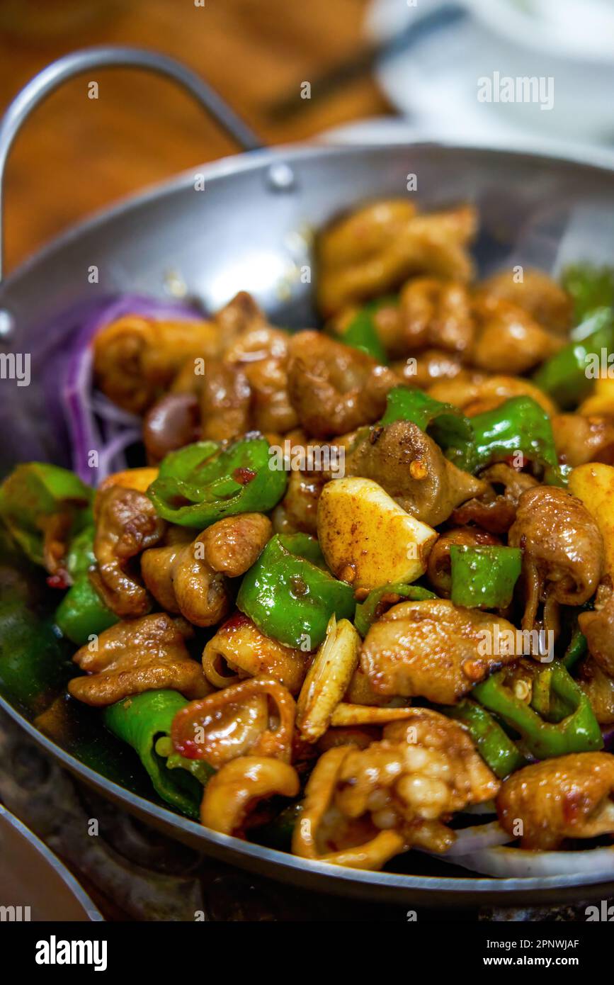 A spicy and delicious Hunan cuisine, deep-fried fat intestines Stock ...