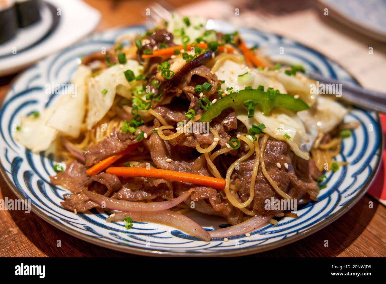 A delicious fatty beef fried ramen in a Japanese restaurant Stock Photo ...