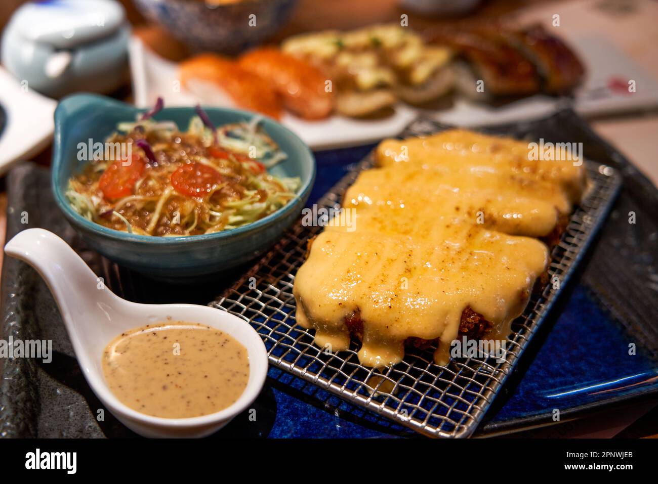 A delicious cheese fried steak in Japanese restaurant Stock Photo - Alamy