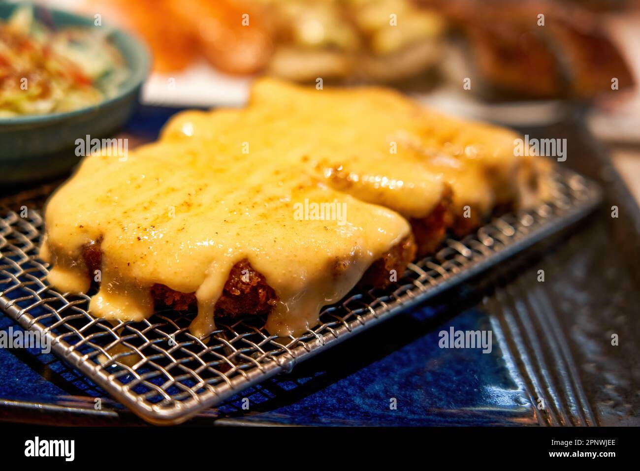 A delicious cheese fried steak in Japanese restaurant Stock Photo - Alamy