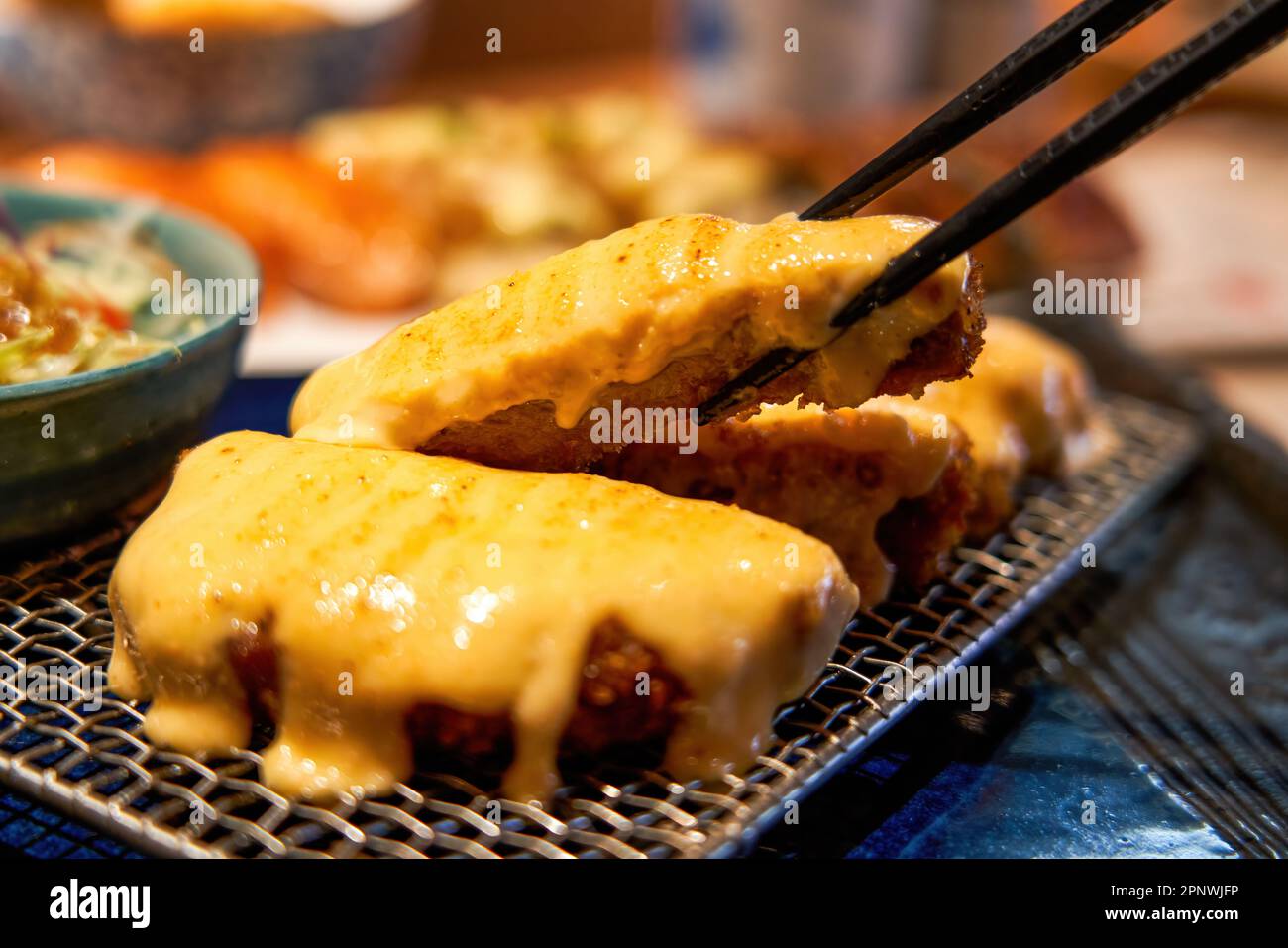 A delicious cheese fried steak in Japanese restaurant Stock Photo - Alamy