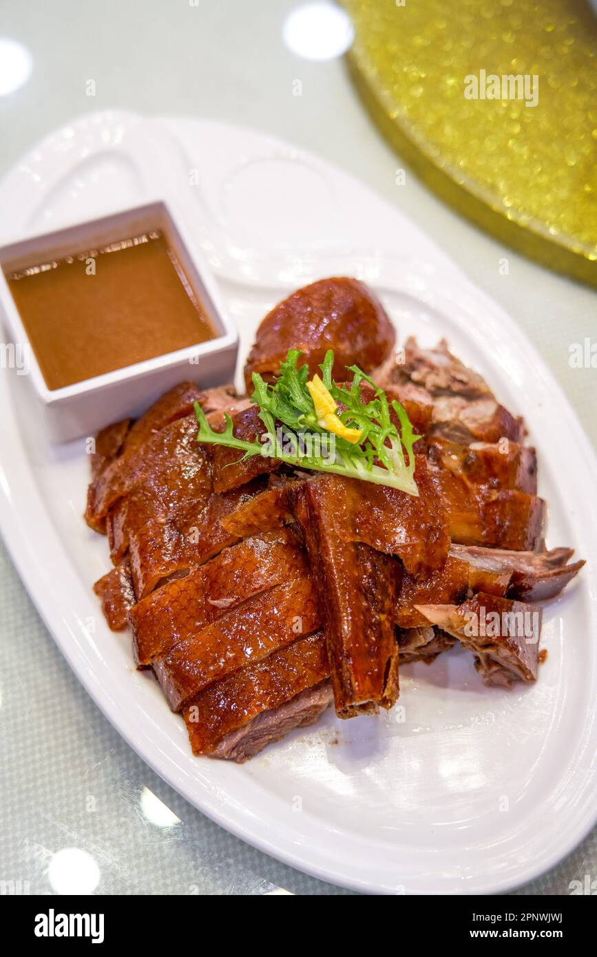 A crispy and delicious Cantonese-style crispy roast goose Stock Photo ...