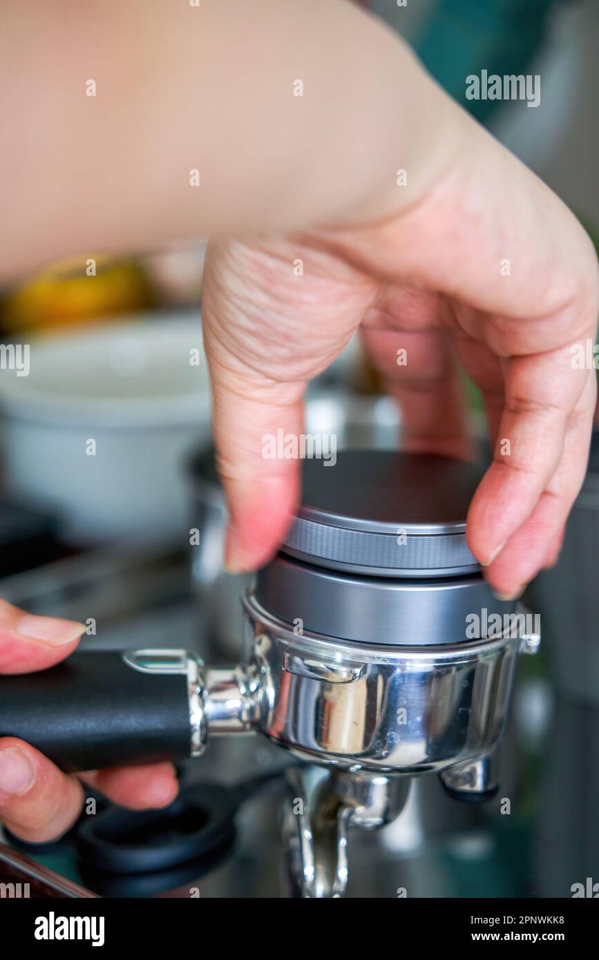 A barista is making a latte with an espresso machine Stock Photo - Alamy