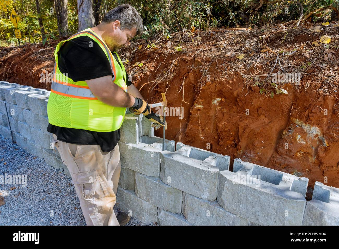 Building retaining wall with retaining blocks on new property is being ...