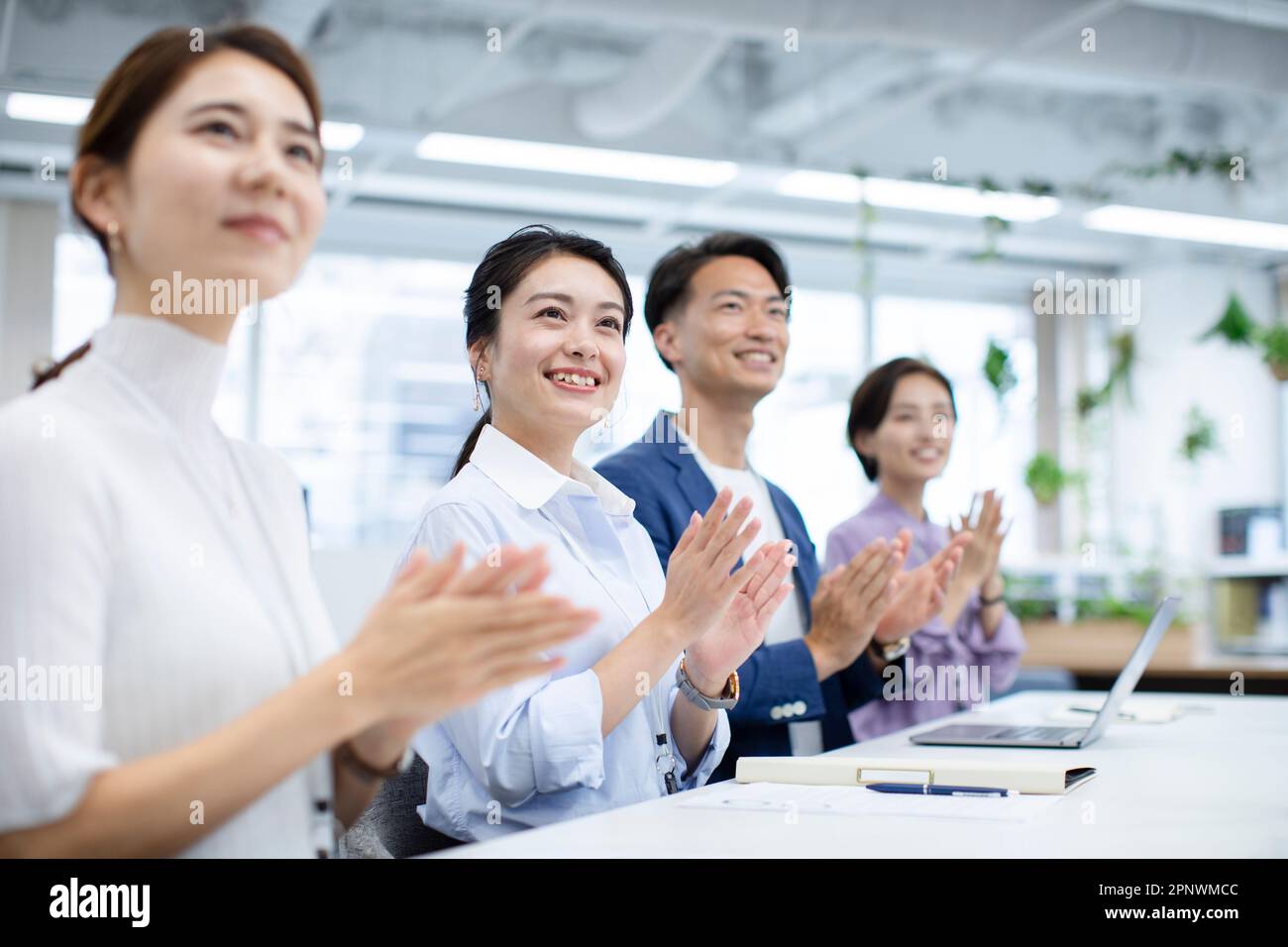 Young businesswoman office meeting applauding hi-res stock photography ...