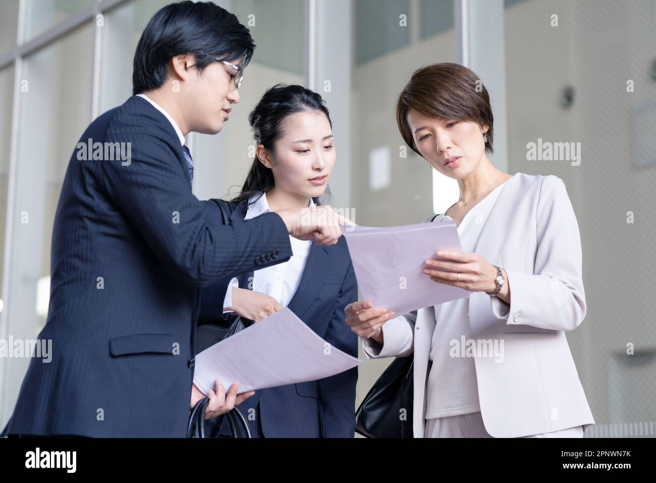 Boss and subordinate looking at documents Stock Photo - Alamy