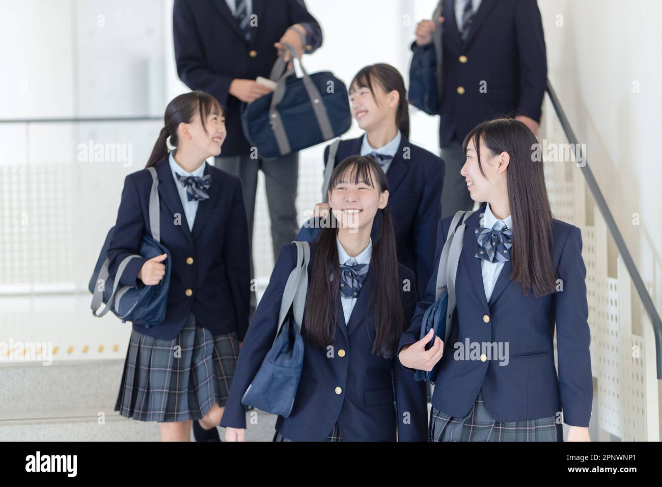 High school student walking in the hallway Stock Photo - Alamy