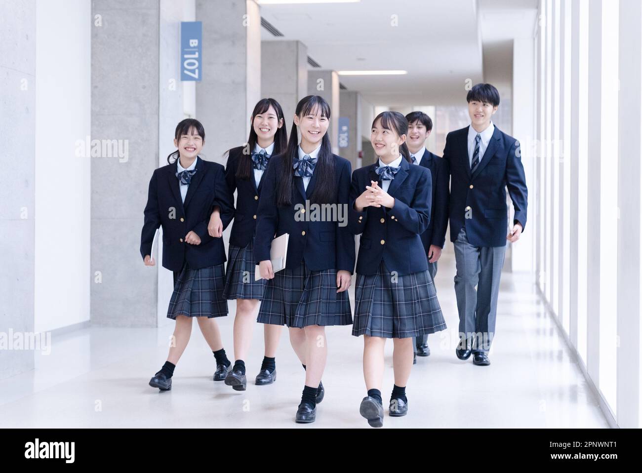 High school students walking in the hallway Stock Photo - Alamy