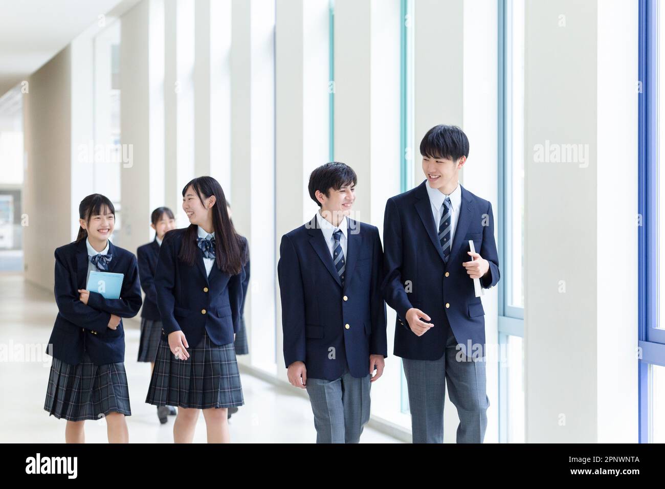 High school students walking in the hallway Stock Photo - Alamy