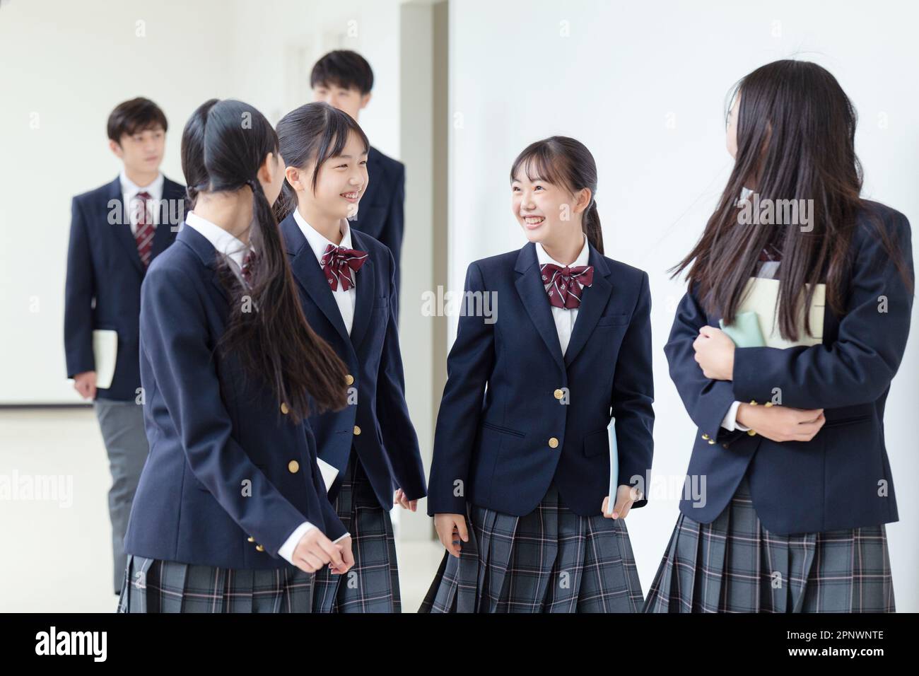 High school students walking in the hallway Stock Photo - Alamy