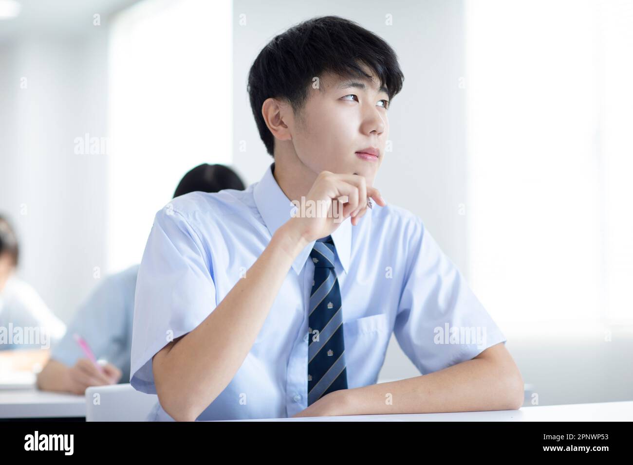 School uniform classroom thinking hi-res stock photography and images ...