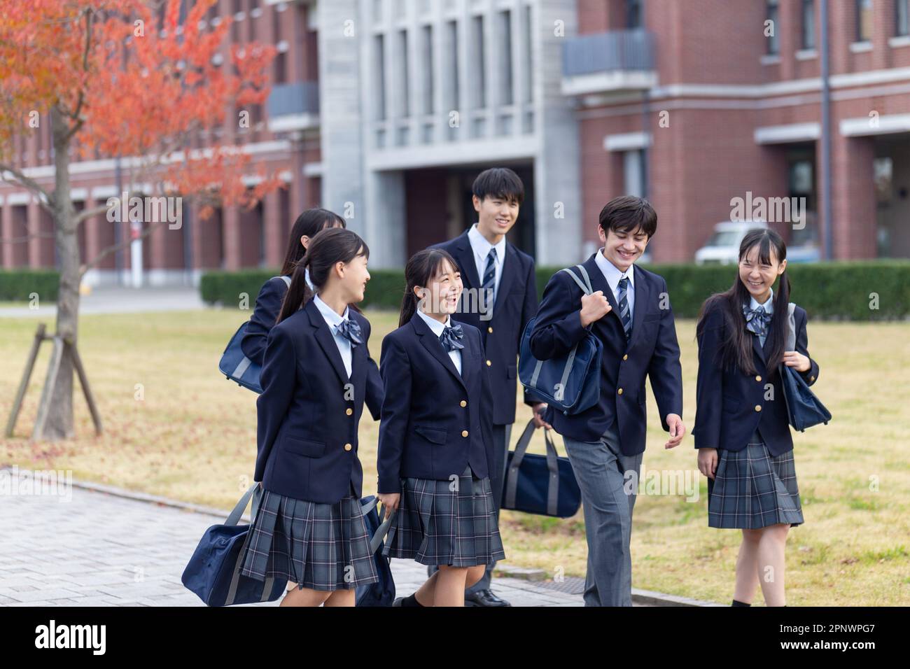 High school students leaving school Stock Photo - Alamy