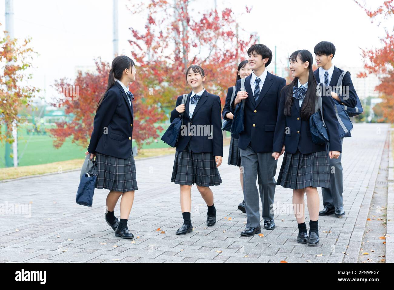 High school students leaving school Stock Photo - Alamy