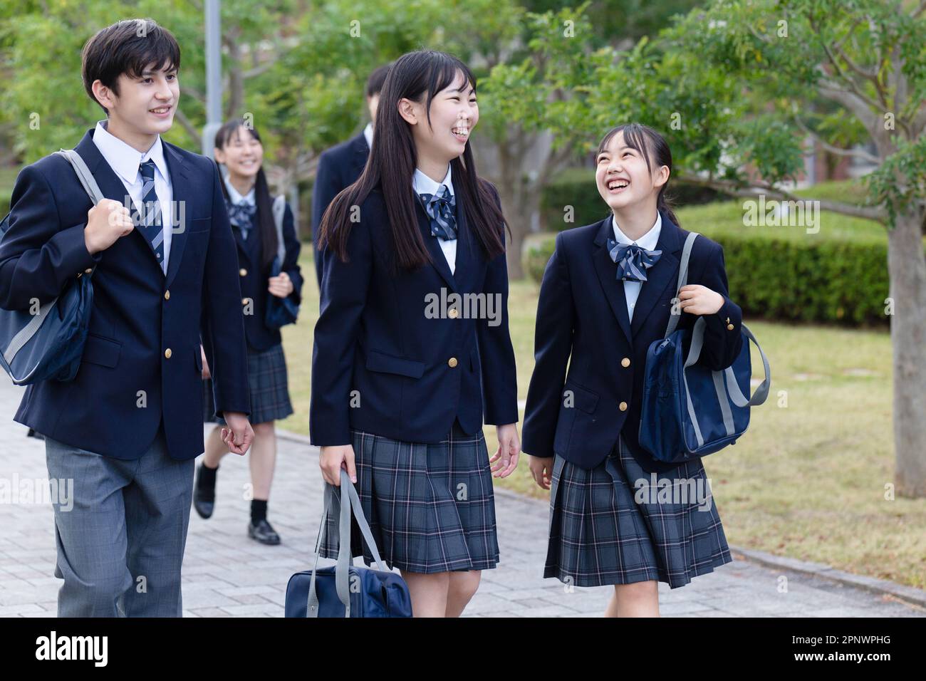 High school students leaving school Stock Photo - Alamy