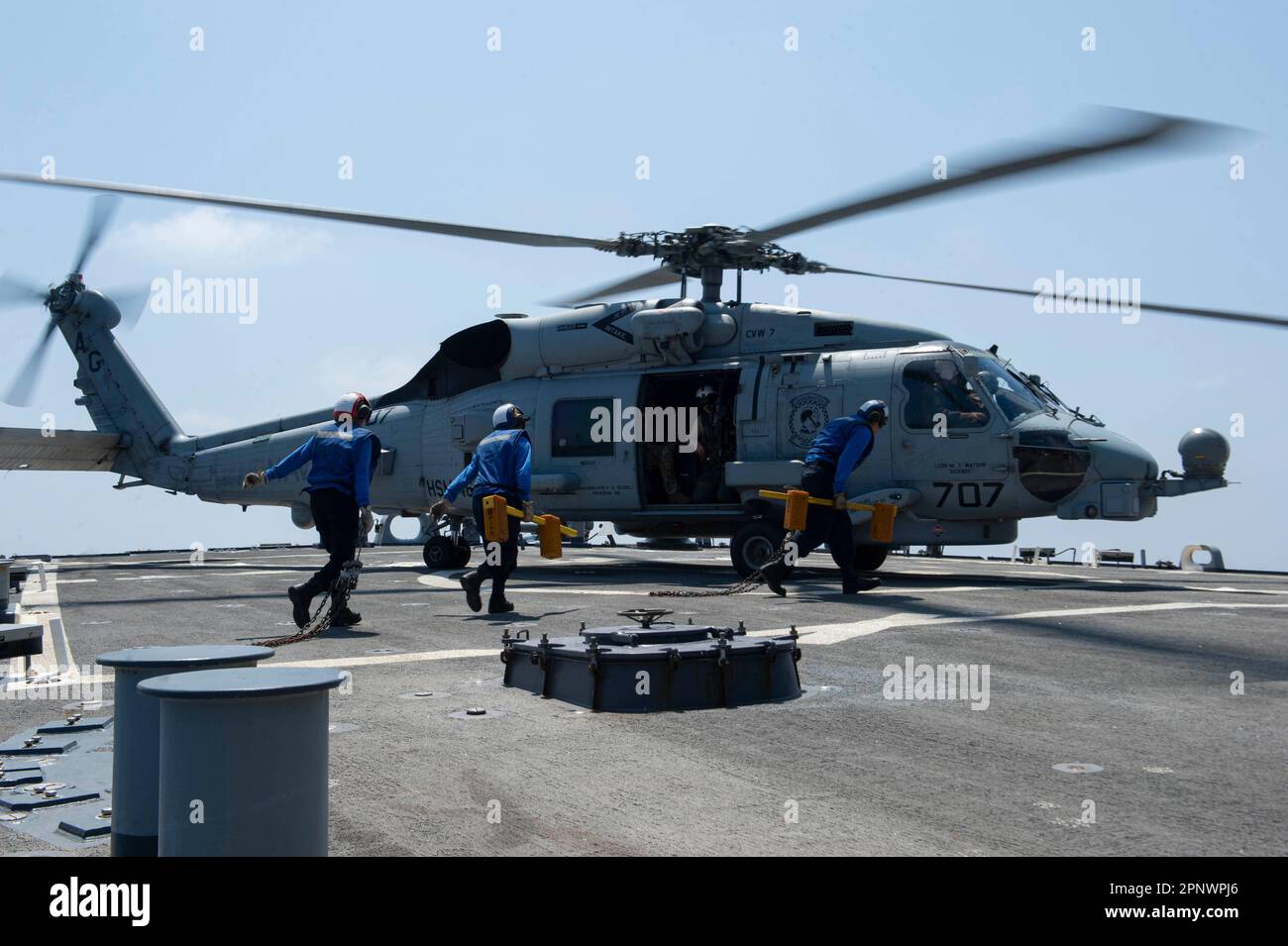 230416-N-NH267-2014 ARABIAN SEA (April 16, 2023) Sailors chock an MH ...