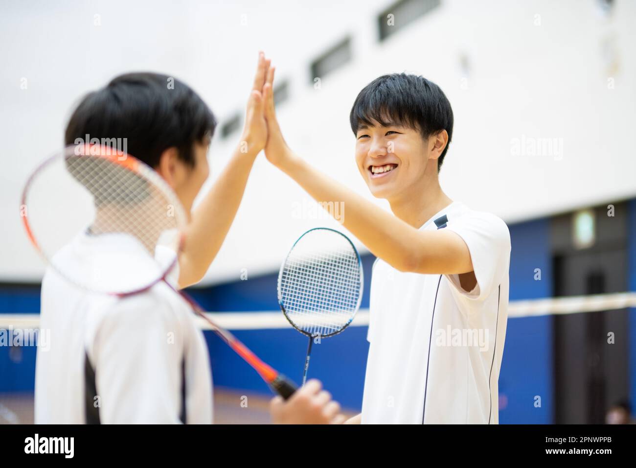 High school students high-fiving Stock Photo - Alamy