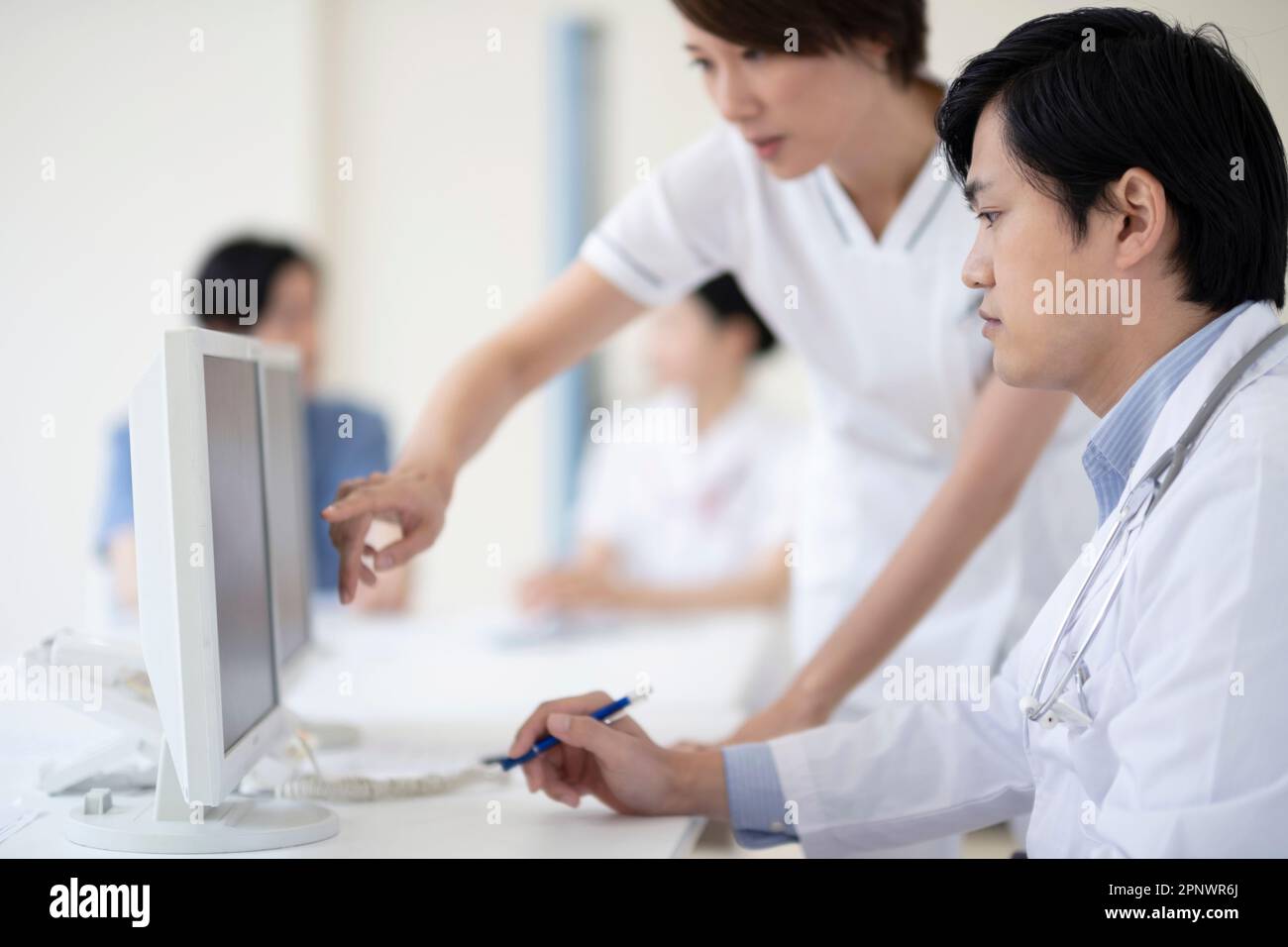 Doctor watching a monitor Stock Photo - Alamy