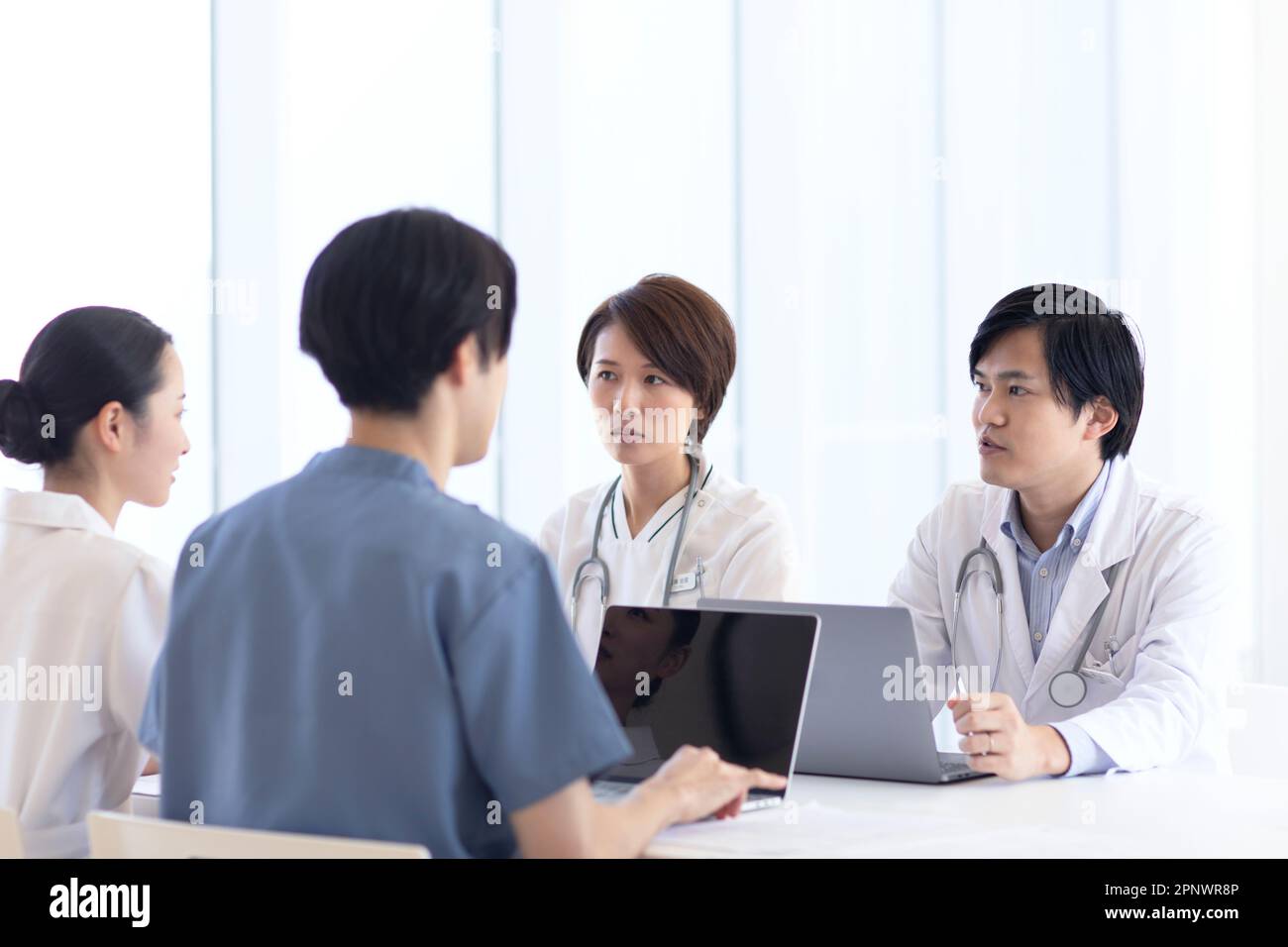 Doctor and nurse in conference Stock Photo - Alamy