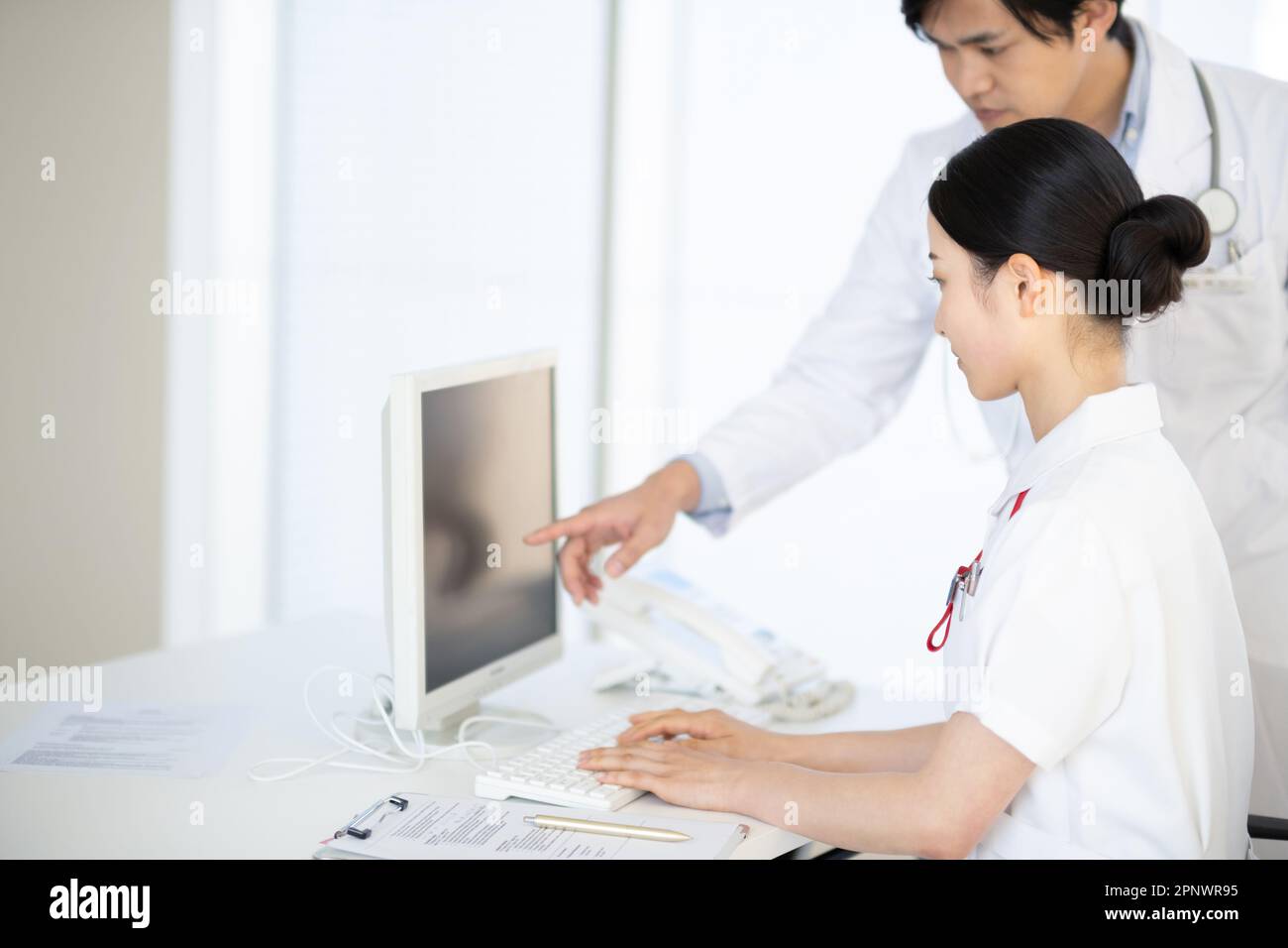 Doctor looking medical monitor hi-res stock photography and images - Alamy