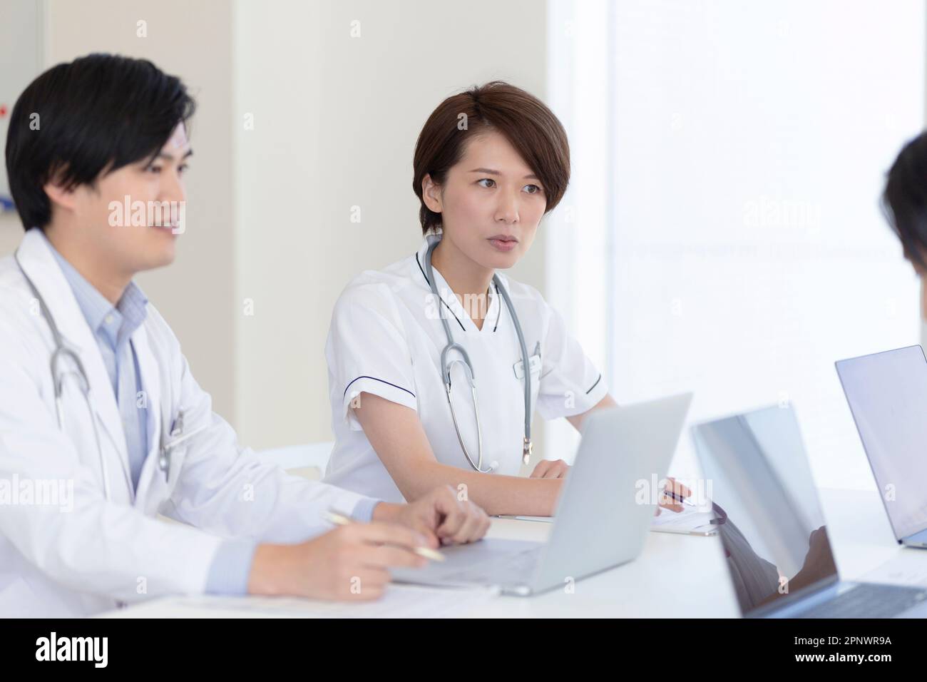Doctor two nurses in hospital hi-res stock photography and images - Alamy