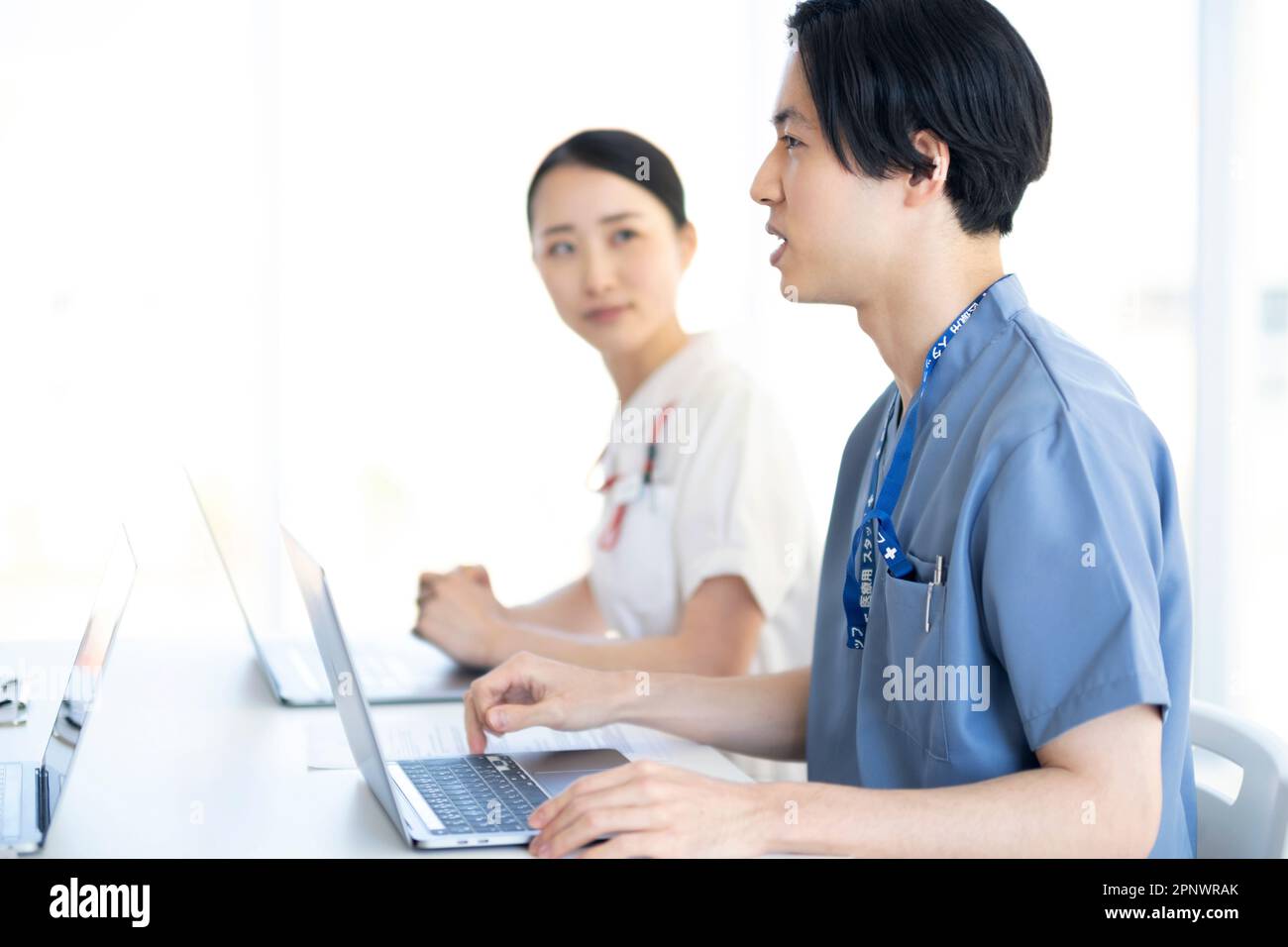 Doctor and nurse in conference Stock Photo - Alamy