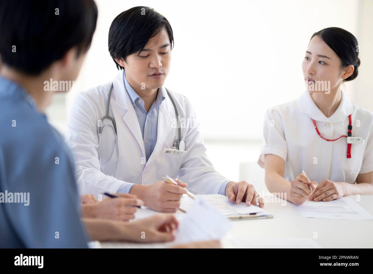 Doctor and nurse in conference Stock Photo - Alamy