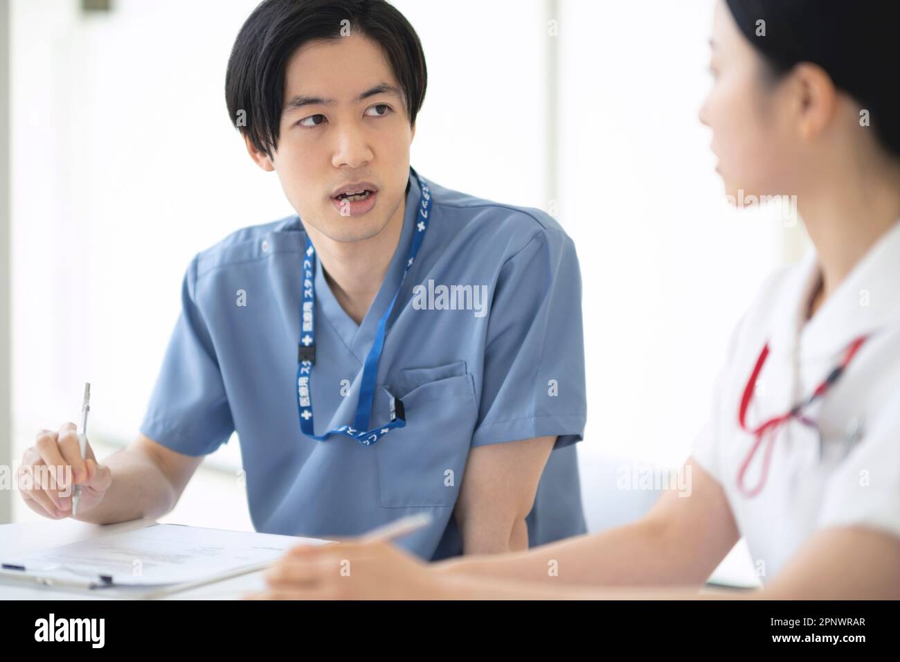 Doctor and nurse in conference Stock Photo - Alamy