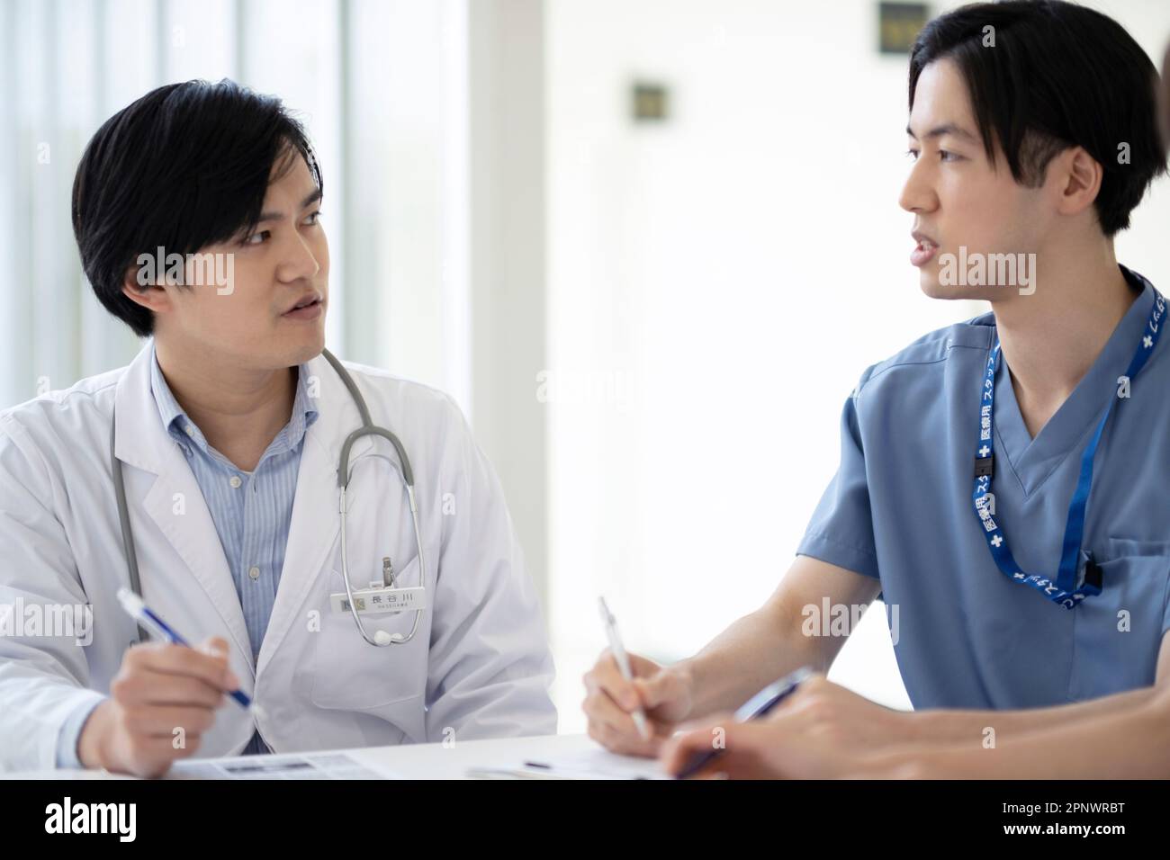 Doctor and nurse in conference Stock Photo - Alamy