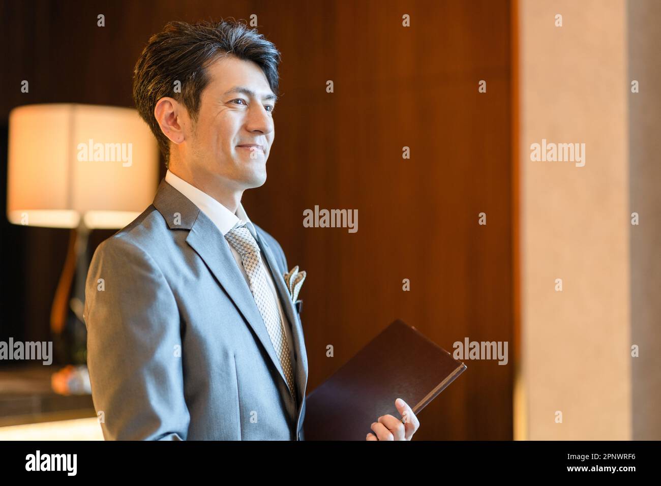 Portrait male receptionist hotel front hi-res stock photography and ...