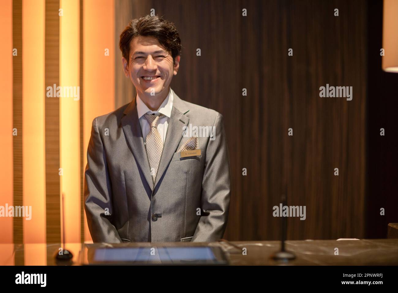 Hotel receptionist male hi-res stock photography and images - Alamy