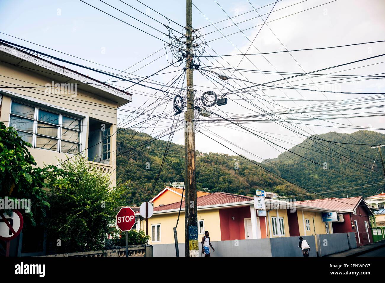 A street scene in central Soufriere, St Lucia and a utility pole ...