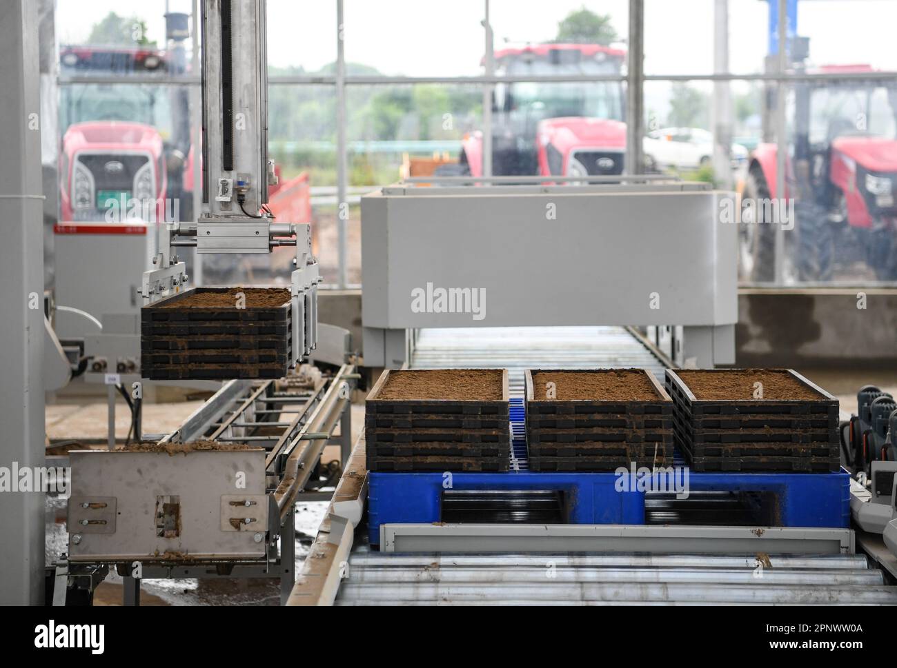 Pengshan, China's Sichuan Province. 20th Apr, 2023. Robotic arms stack ...