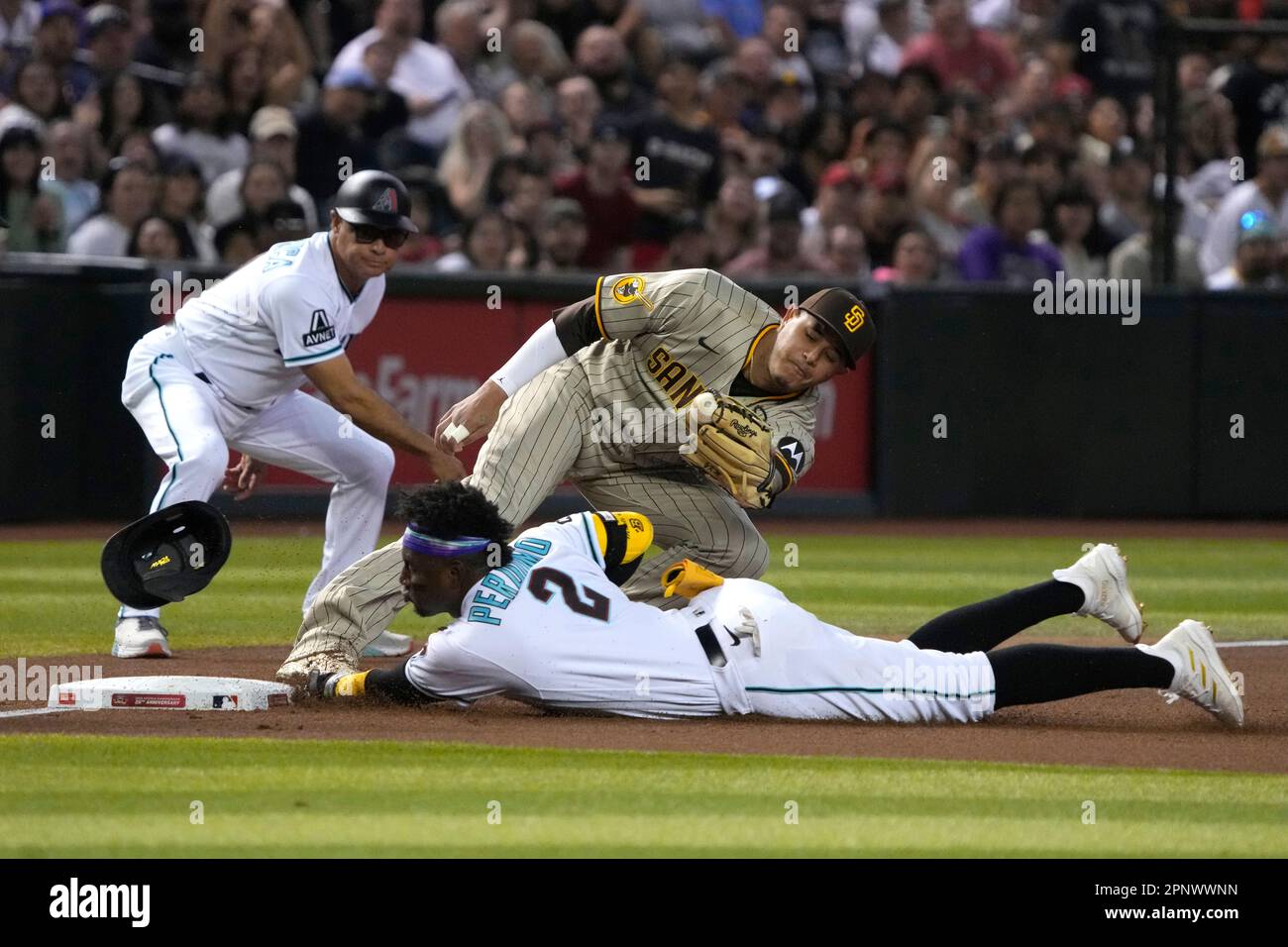 Arizona Diamondbacks' Geraldo Perdomo (2) dives into thirdbase after ...