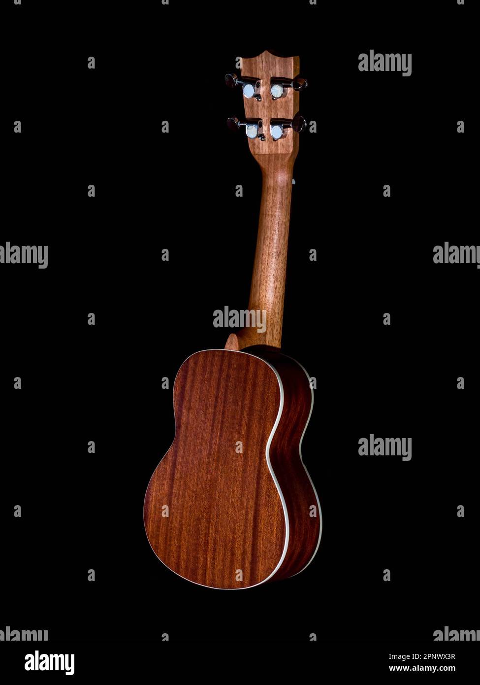 back of hawaii ukulele guitar isolated against black background Stock ...