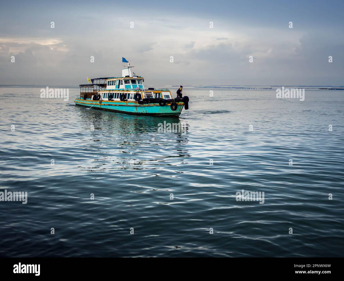 Small ferry boat for cross the island Stock Photo - Alamy