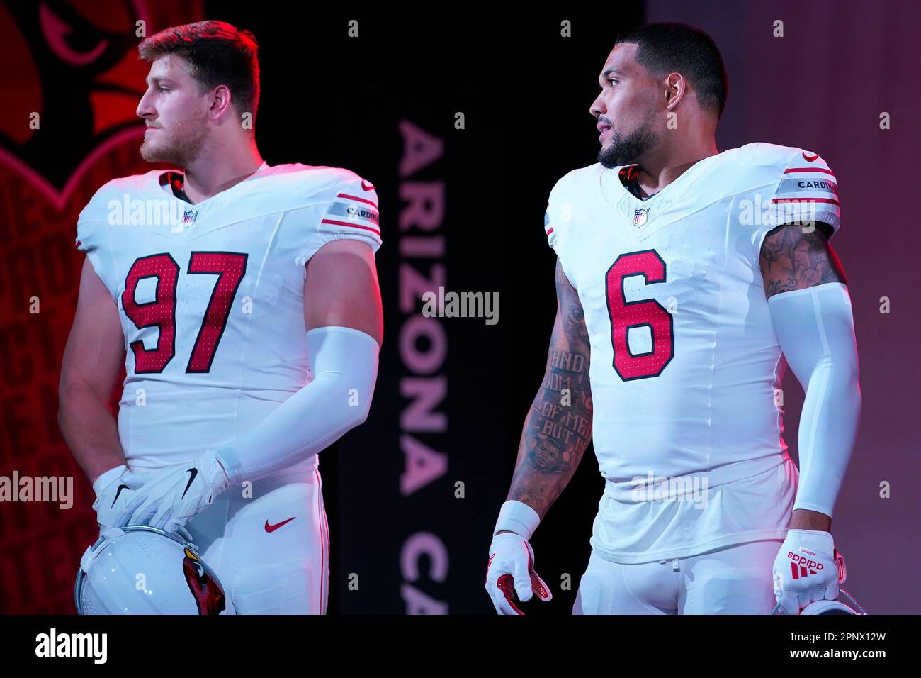 Arizona Cardinals linebacker Cameron Thomas (97) and running back James ...
