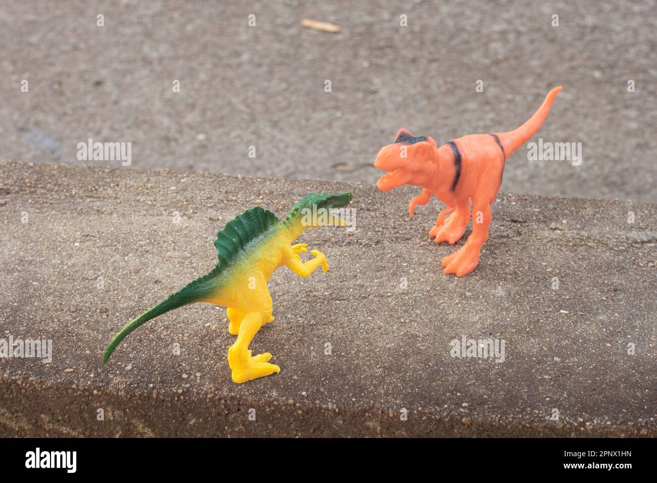 infrared image of the dinosaur toys on the asphalt street Stock Photo ...