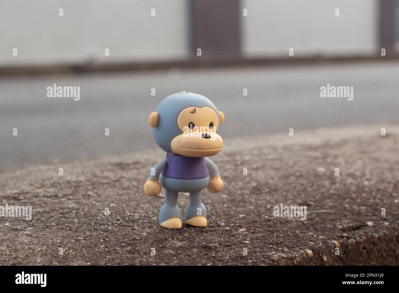 infrared image of the monkey toys on the asphalt street Stock Photo - Alamy