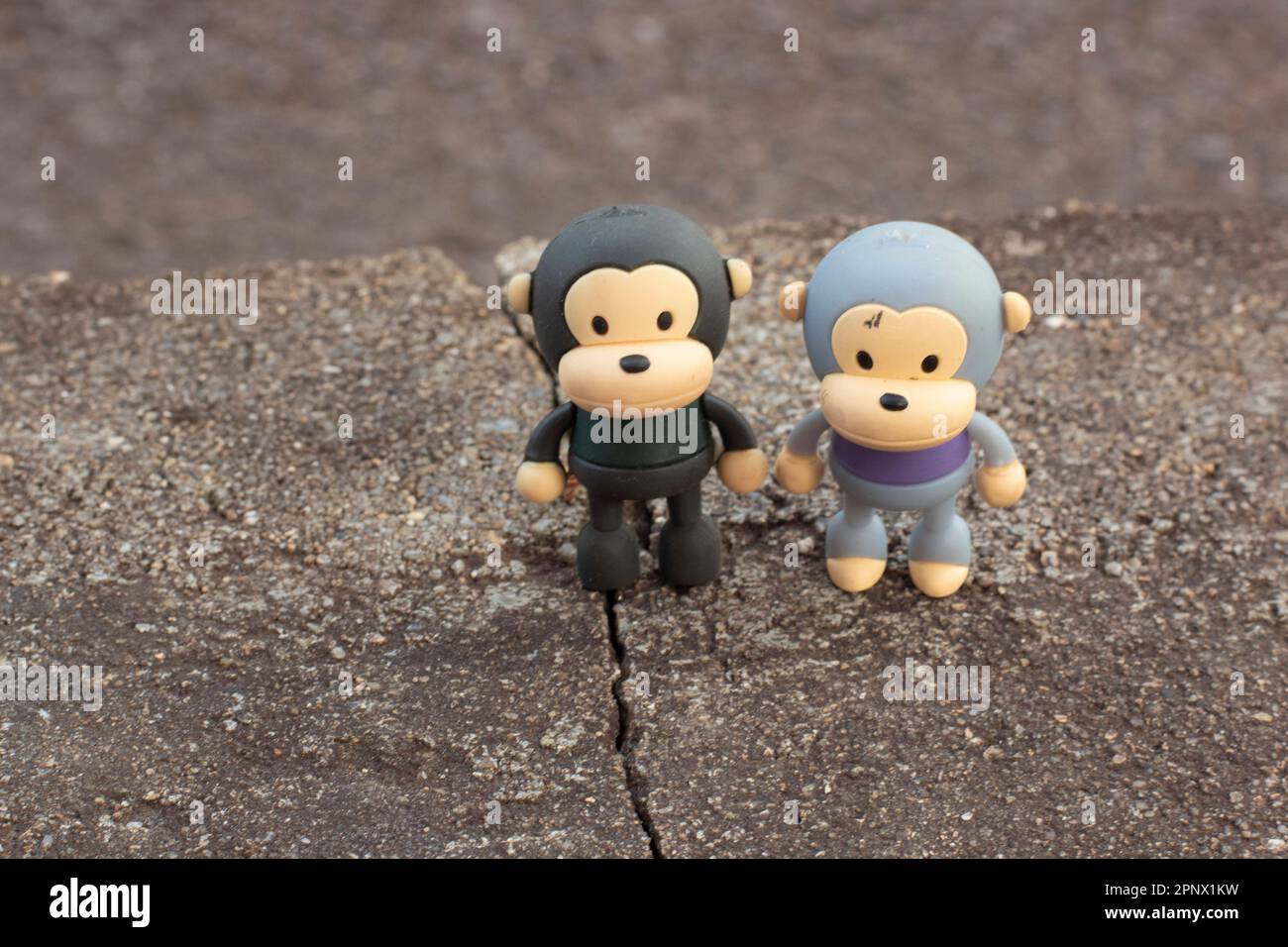 infrared image of the monkey toys on the asphalt street Stock Photo - Alamy