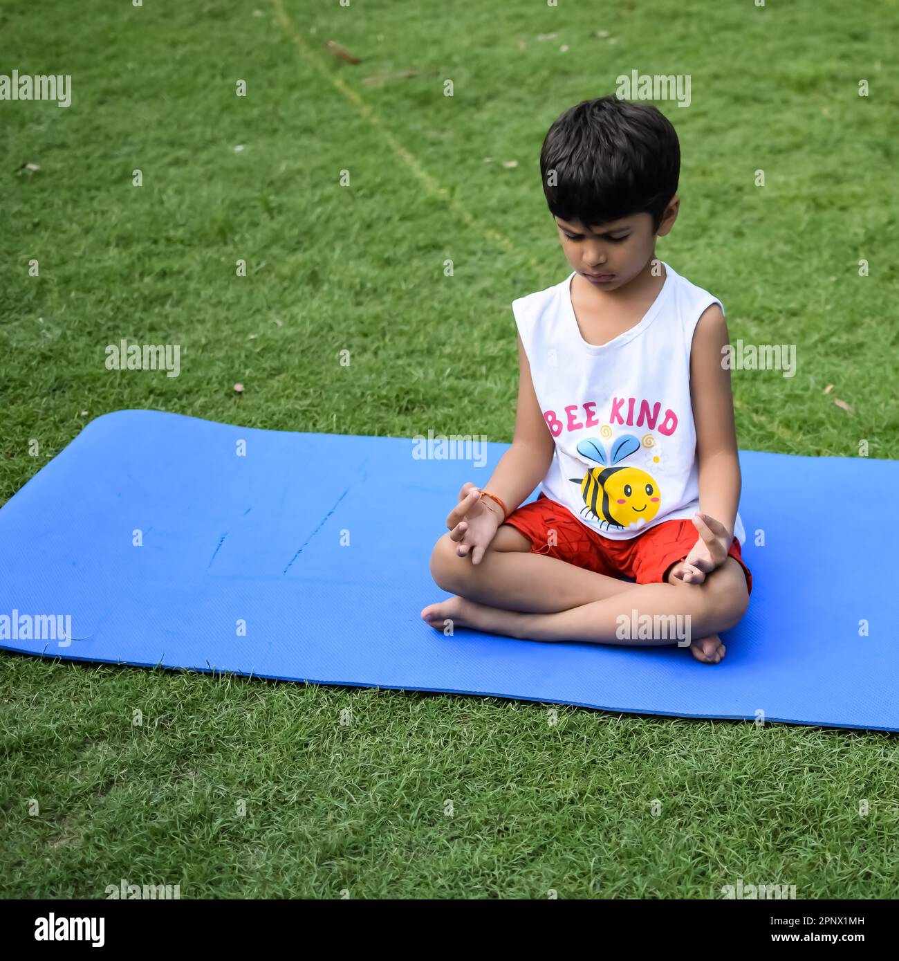 Asian smart kid doing yoga pose in the society park outdoor, Children's ...