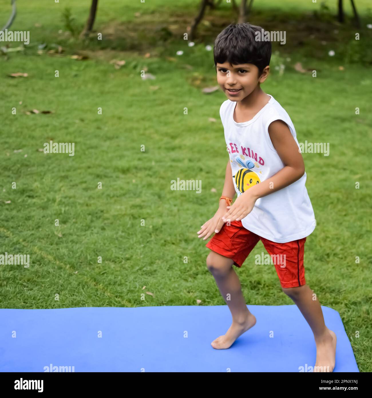 Asian smart kid doing yoga pose in the society park outdoor, Children's ...