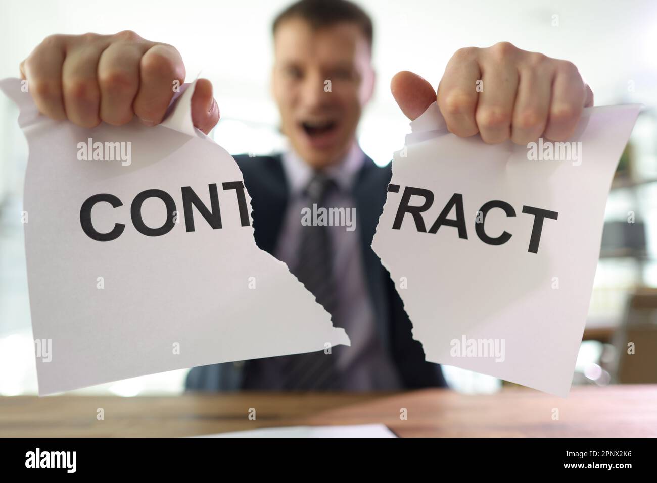 Man holds torn sheet of paper expressing dissatisfaction Stock Photo ...
